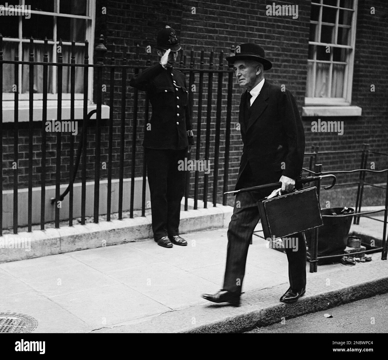 Chancellor of the Exchequer Sir John Simon arrives at number ten ...