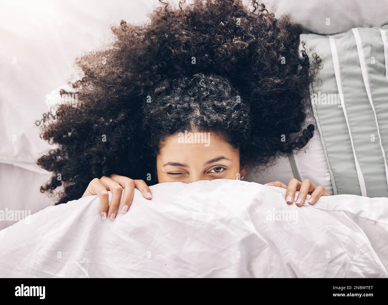Girl sleeping under covers hi-res stock photography and images - Alamy