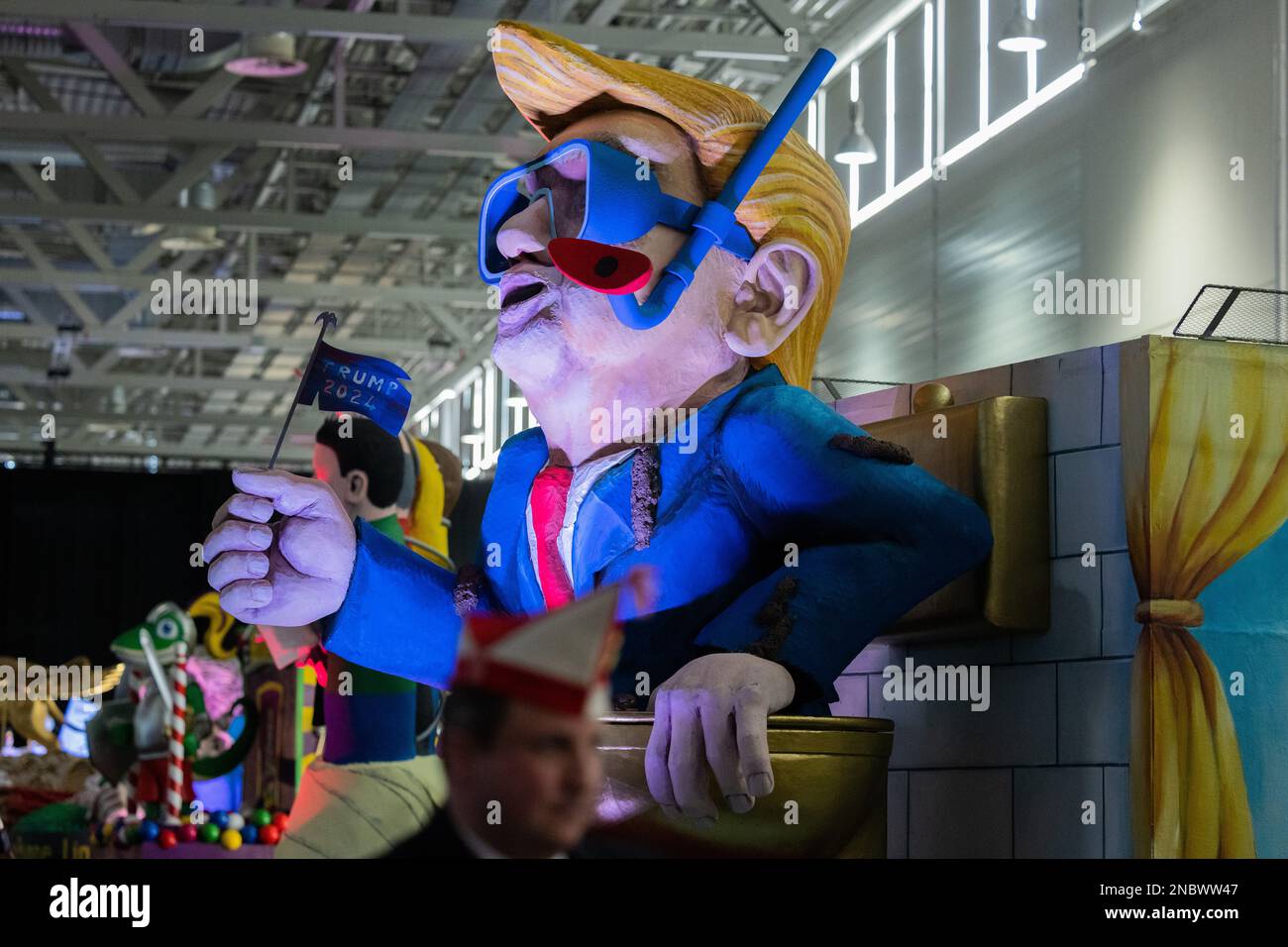 Cologne, Germany. 14th Feb, 2023. A theme float showing former U.S ...