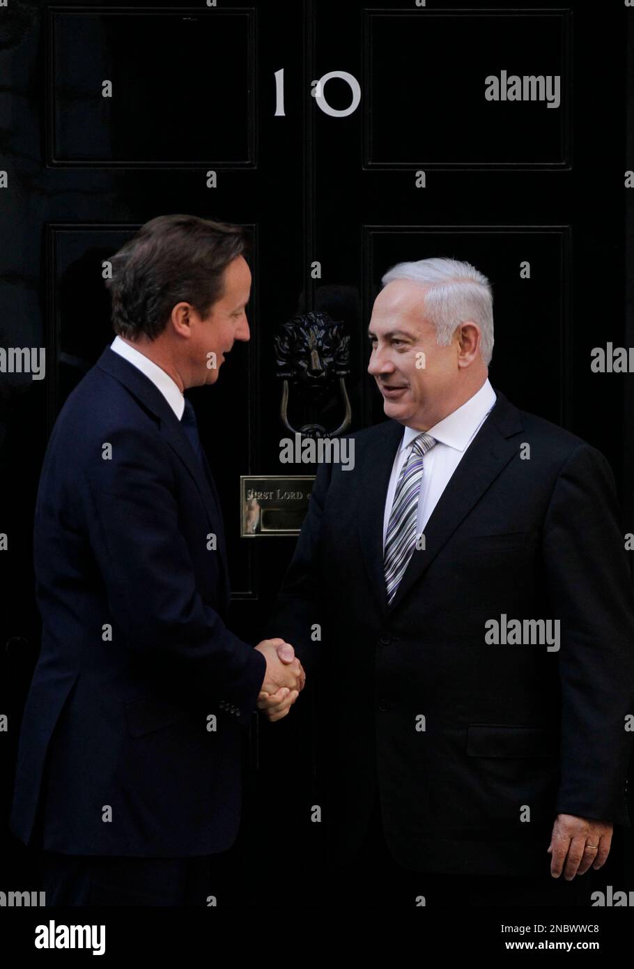 Israeli Prime Minister Benjamin Netanyahu, right, is greeted by British ...