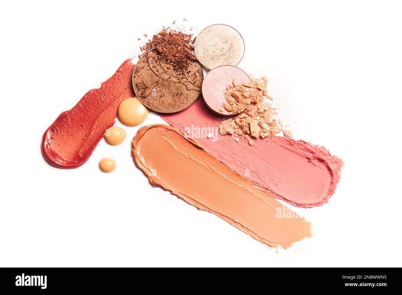 Make-up swatches- brown and skin-colored powder, skin-colored drops ...