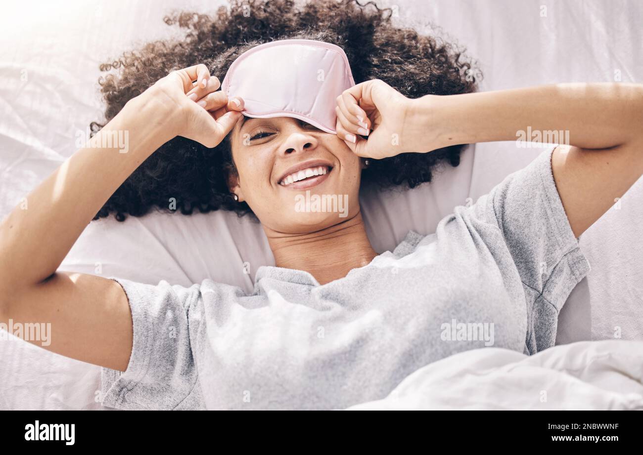 Sleeping, wake up and black woman with eye mask in bed, dream and ...