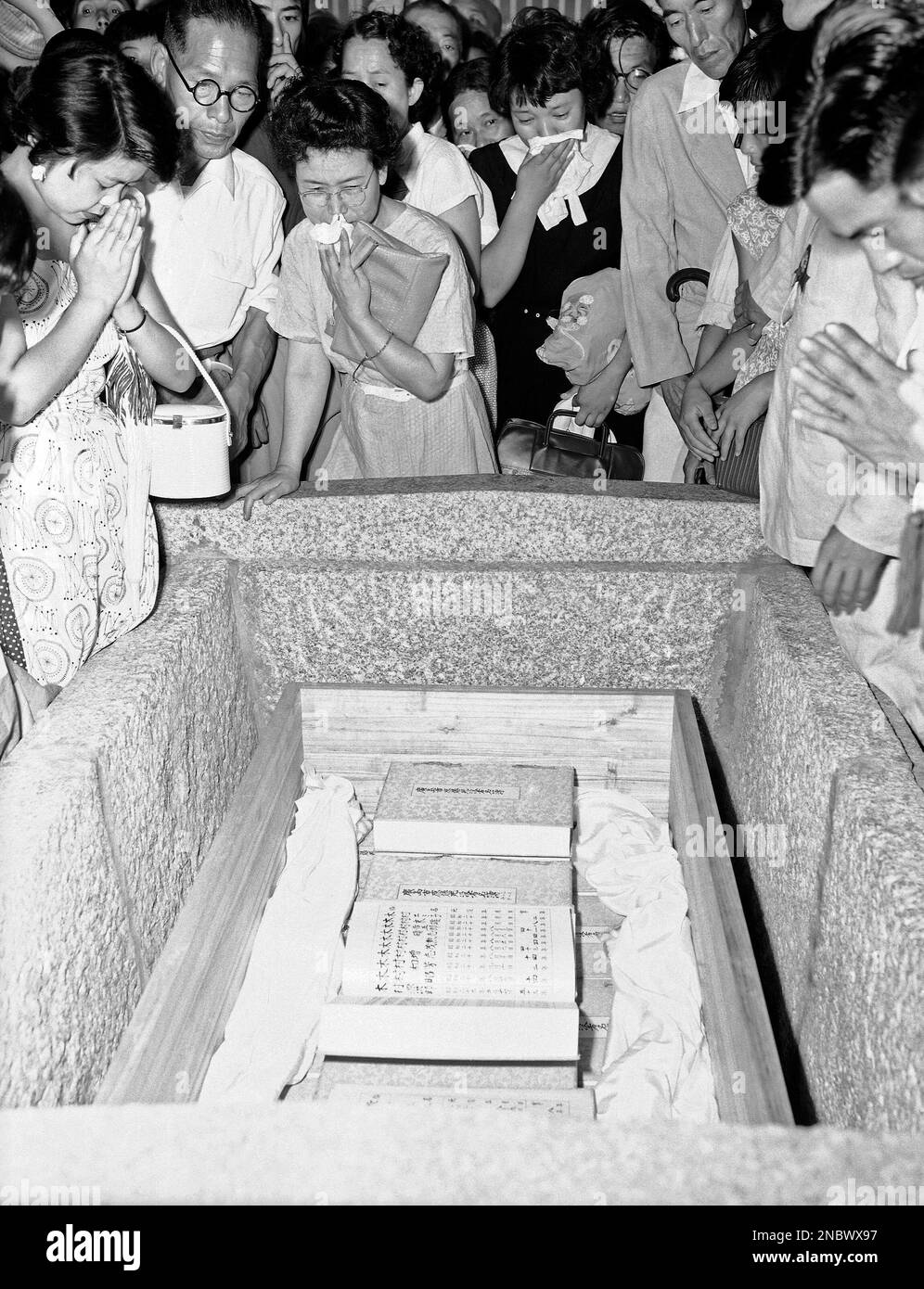 Relatives weep and pray as they view 212 names that have been added to ...