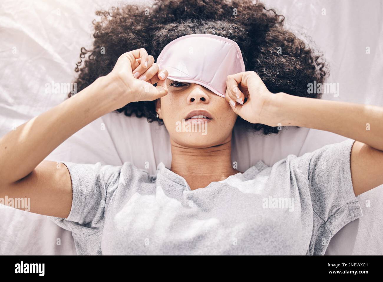 Sleep, relax and black woman with eye mask waking up, dream and refresh ...