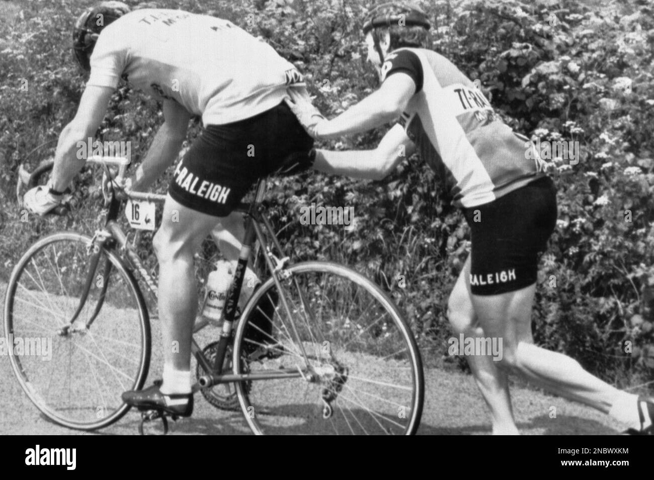 Dutch cyclist and race leader Jan Raas receives help from team mate ...