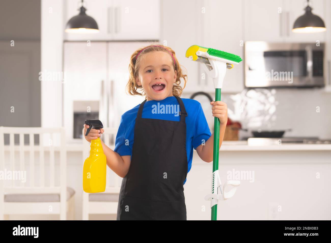 Kid helping with housework, cleaning. Little kid cleaning at home ...