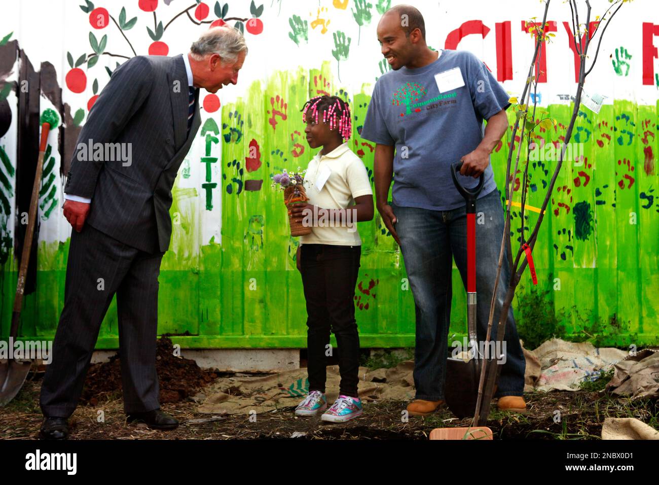 Britain's Prince Charles, left, talks with Nicole Pendergast, 7, and ...