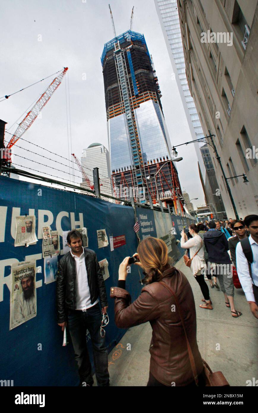 Visitors make photos of news clippings about the death of Osama bin ...
