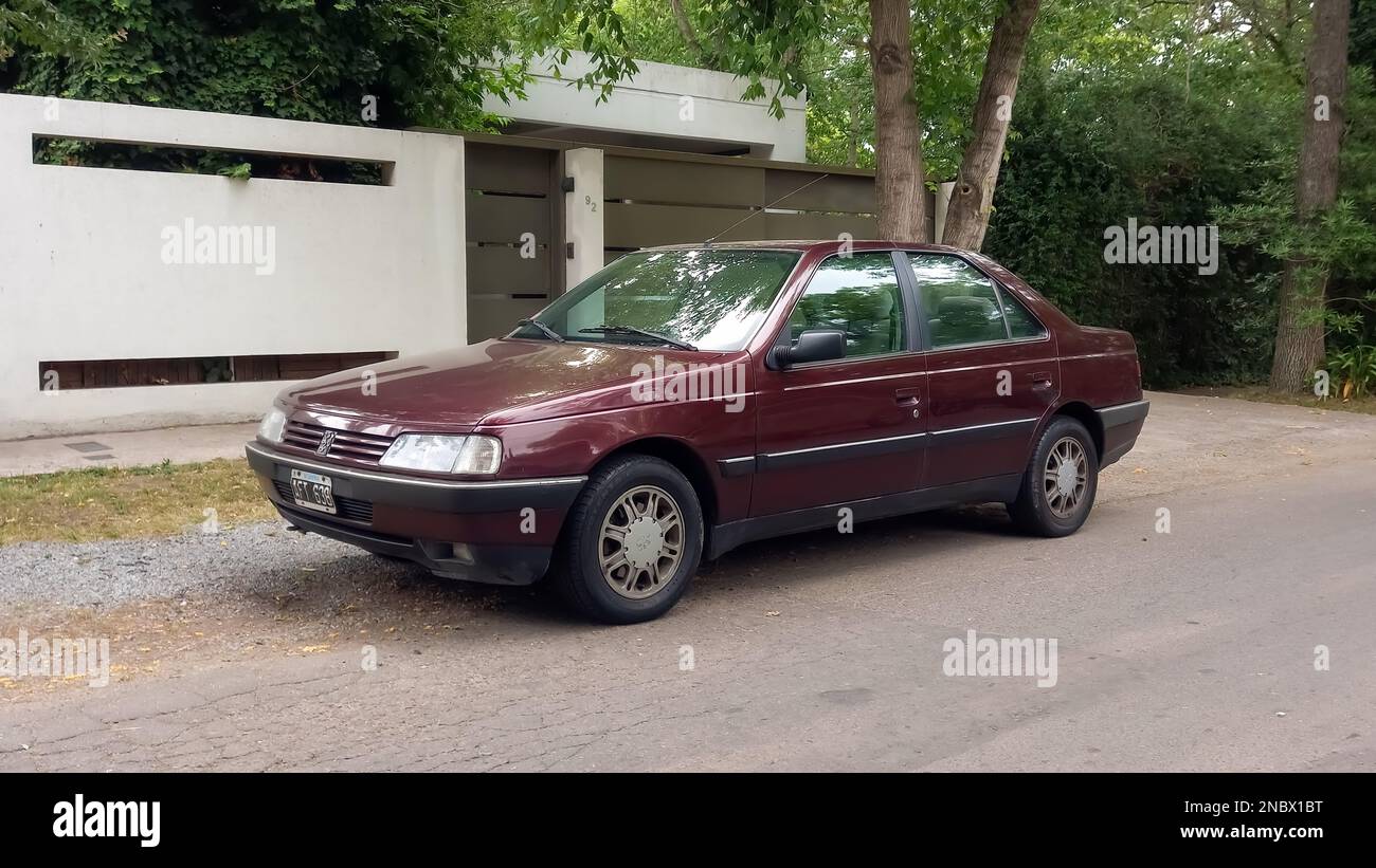 Old red 1995 Peugeot 405 SRI saloon, sedan in the street. Sunny day ...