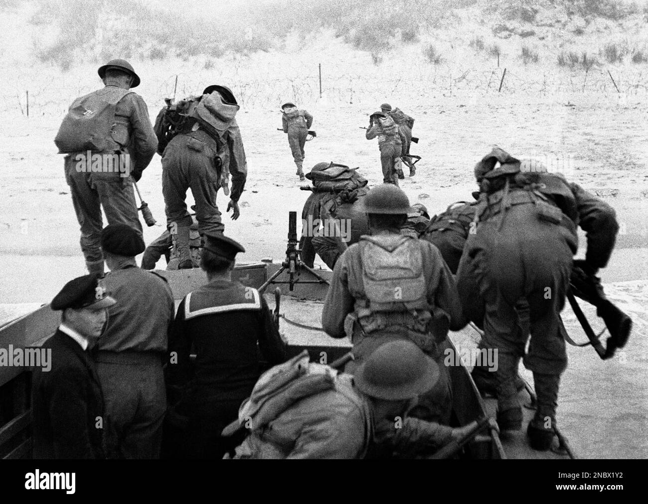 Members of the Commandoes and U.S. Rangers take part in a landing ...