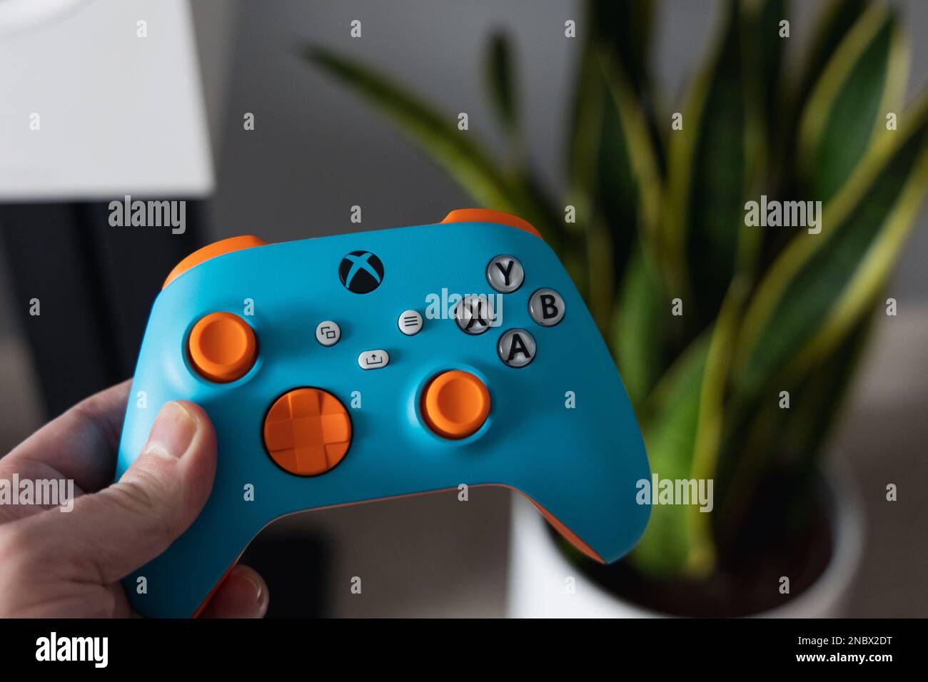 LONDON - FEBRUARY 14, 2023: Man holding Xbox Design Lab custom gaming ...