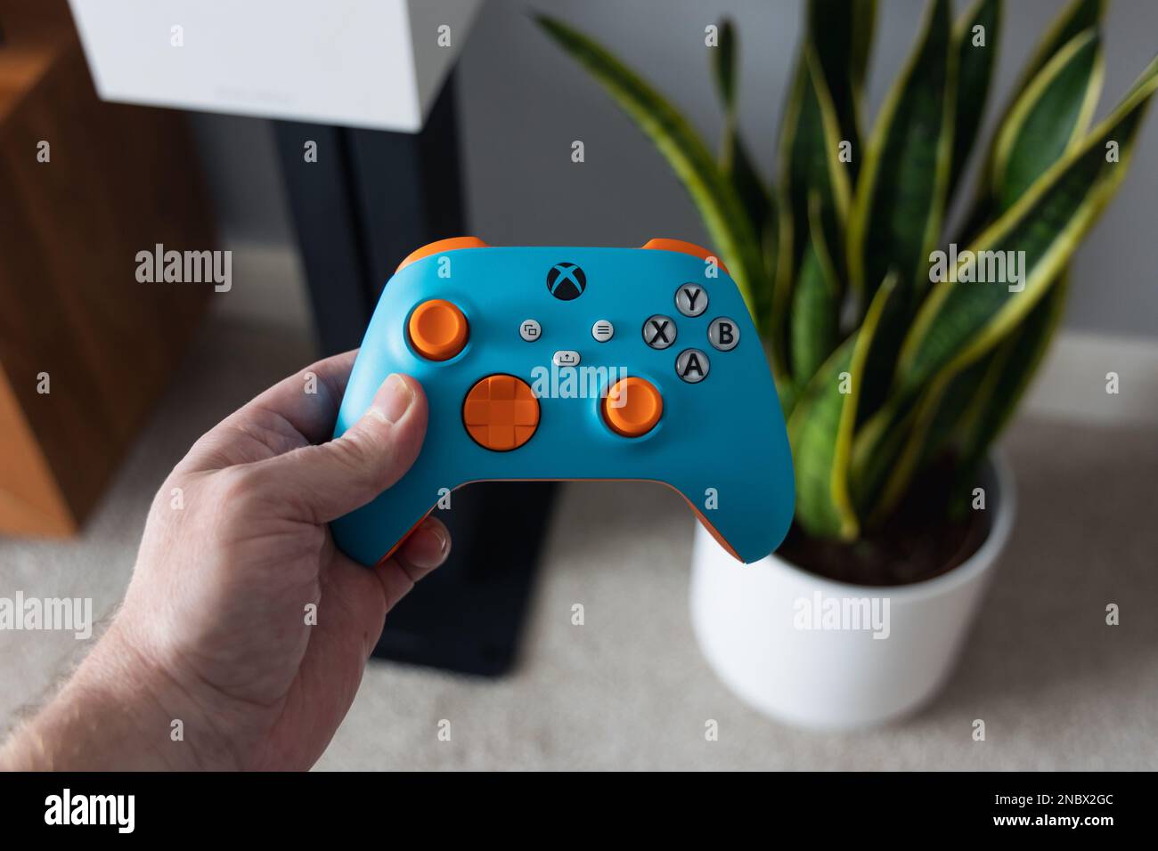 LONDON - FEBRUARY 14, 2023: Man holding Xbox Design Lab custom gaming ...