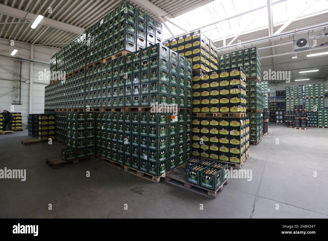 Apolda, Germany. 14th Feb, 2023. Beer crates stand in a warehouse. The ...