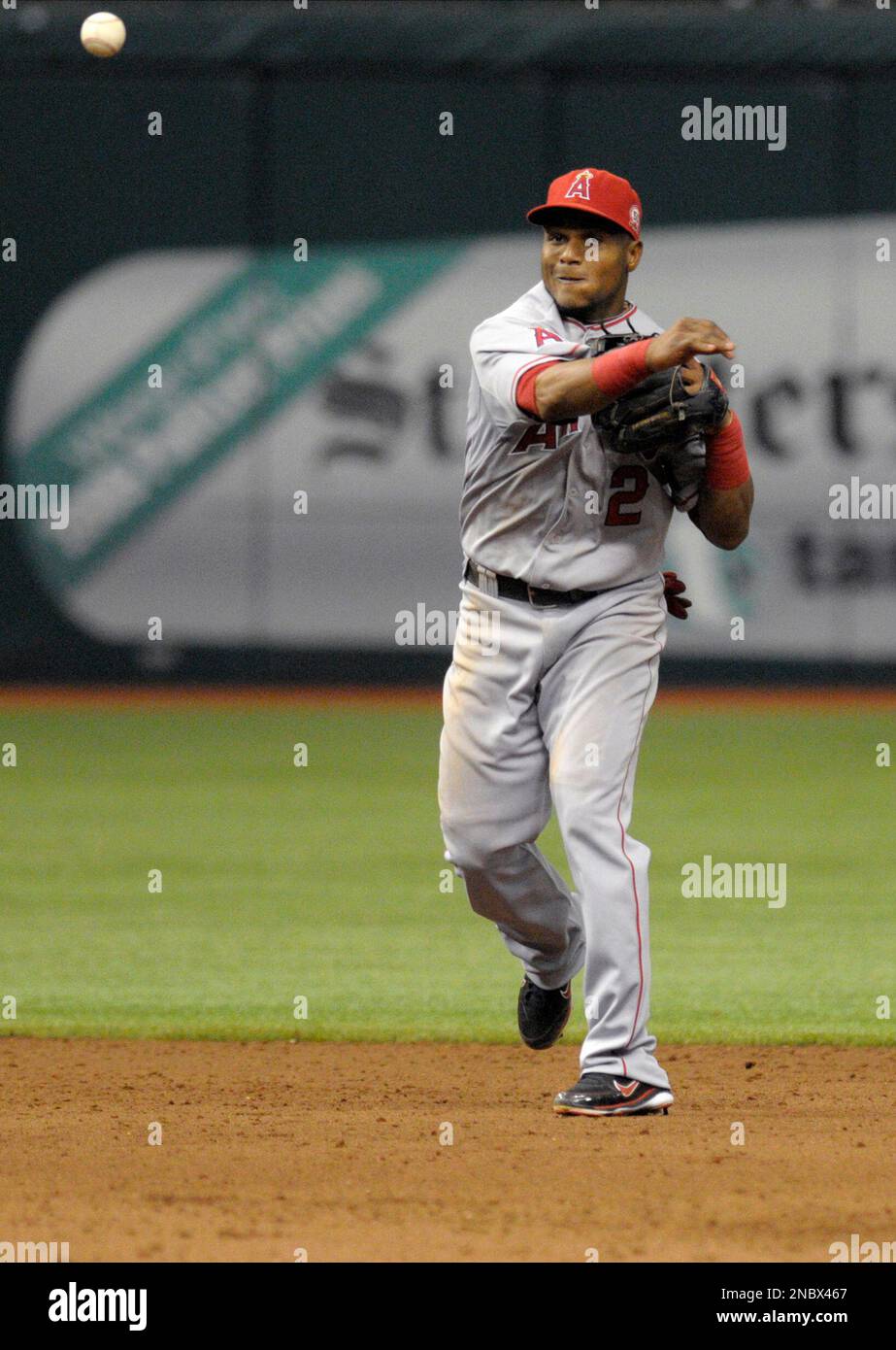 Los Angeles Angels shortstop Erick Aybar throws out a batter at first ...