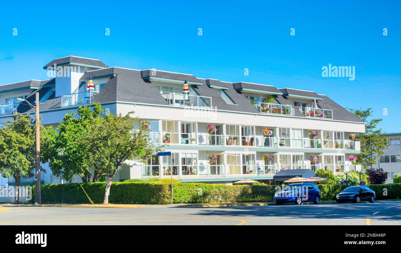 Street view with nice residential building in Victoria, British ...