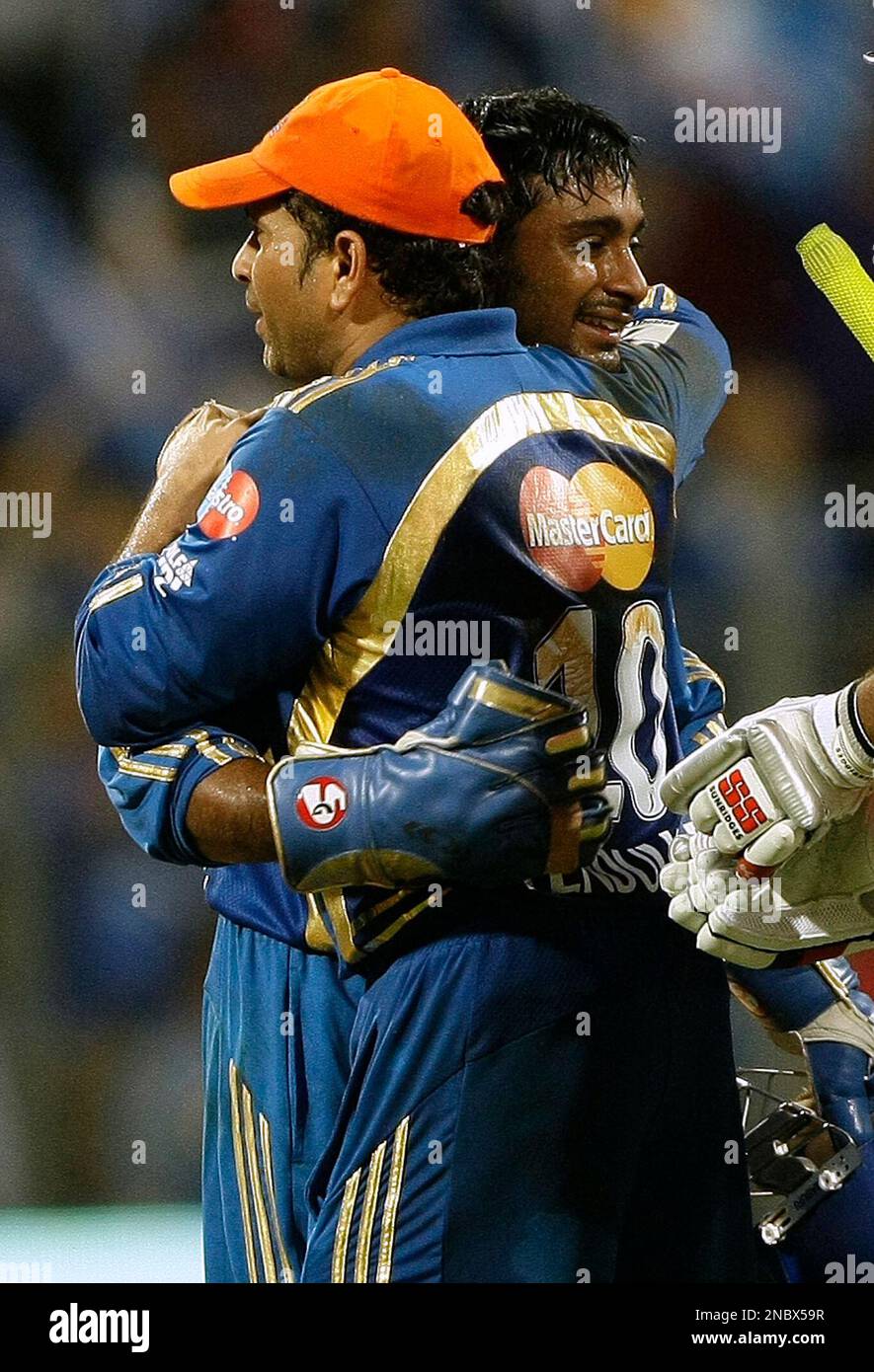 Mumbai Indians players Sachin Tendulkar and Ambati Rayudu, right, celebrate after they won the ...