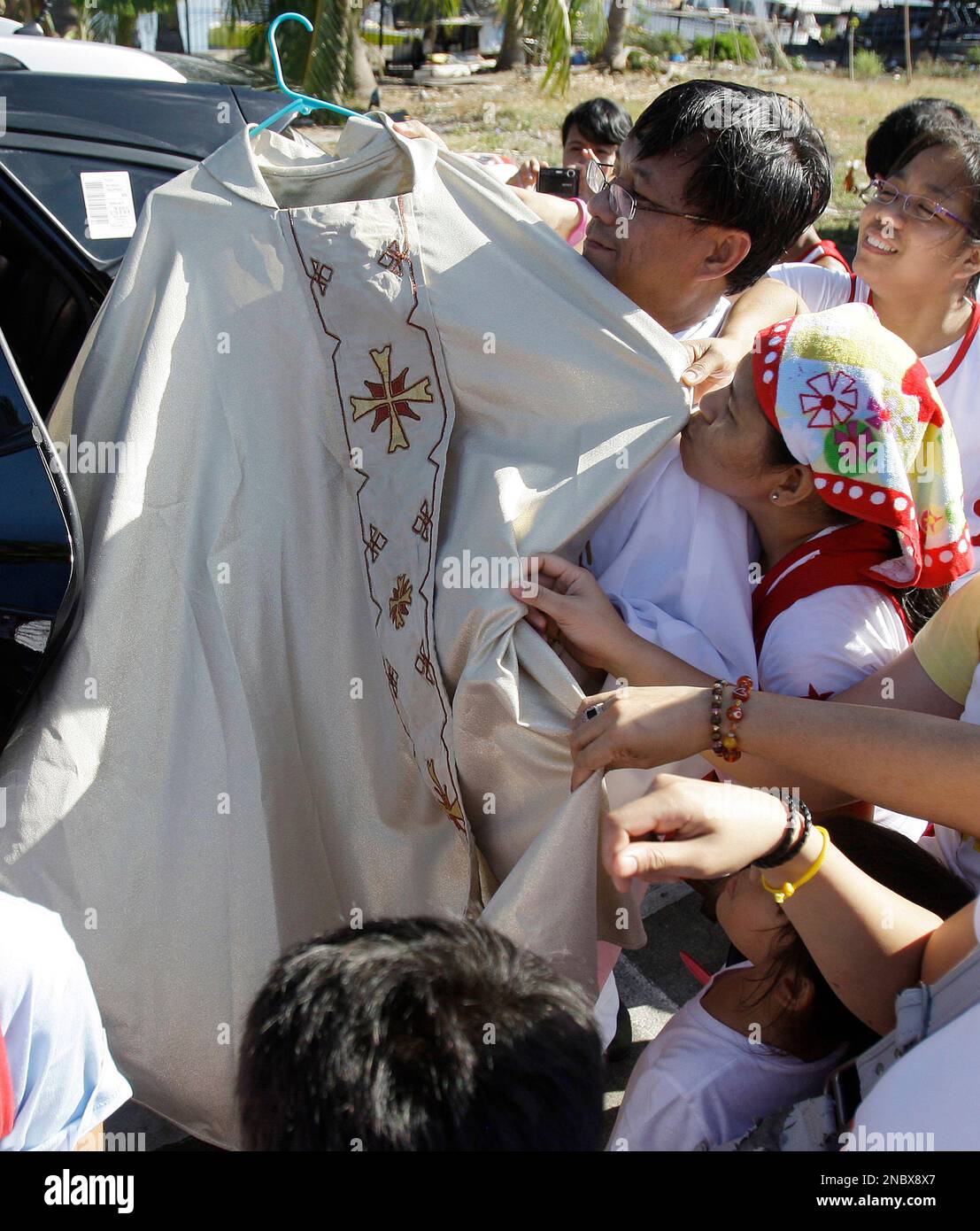 A Filipino devotee kisses a religious cloak which Pope John Paul II ...