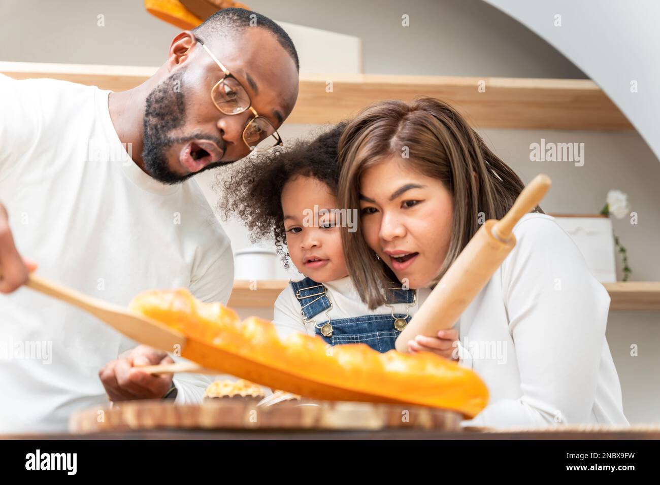 African family, father, mother, daughter doing various activities ...