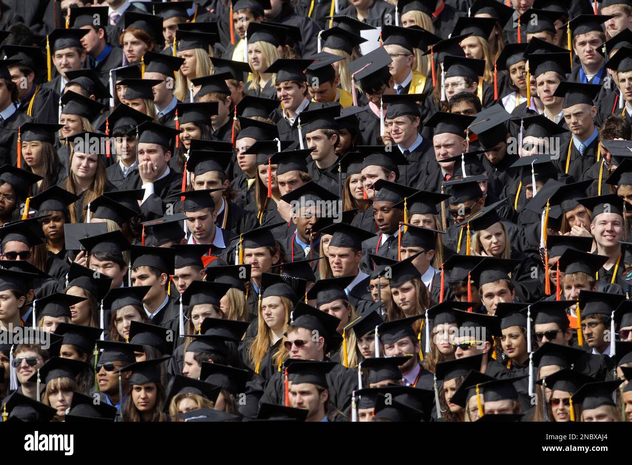 Graduates listen at the University of Michigan commencement at Michigan ...