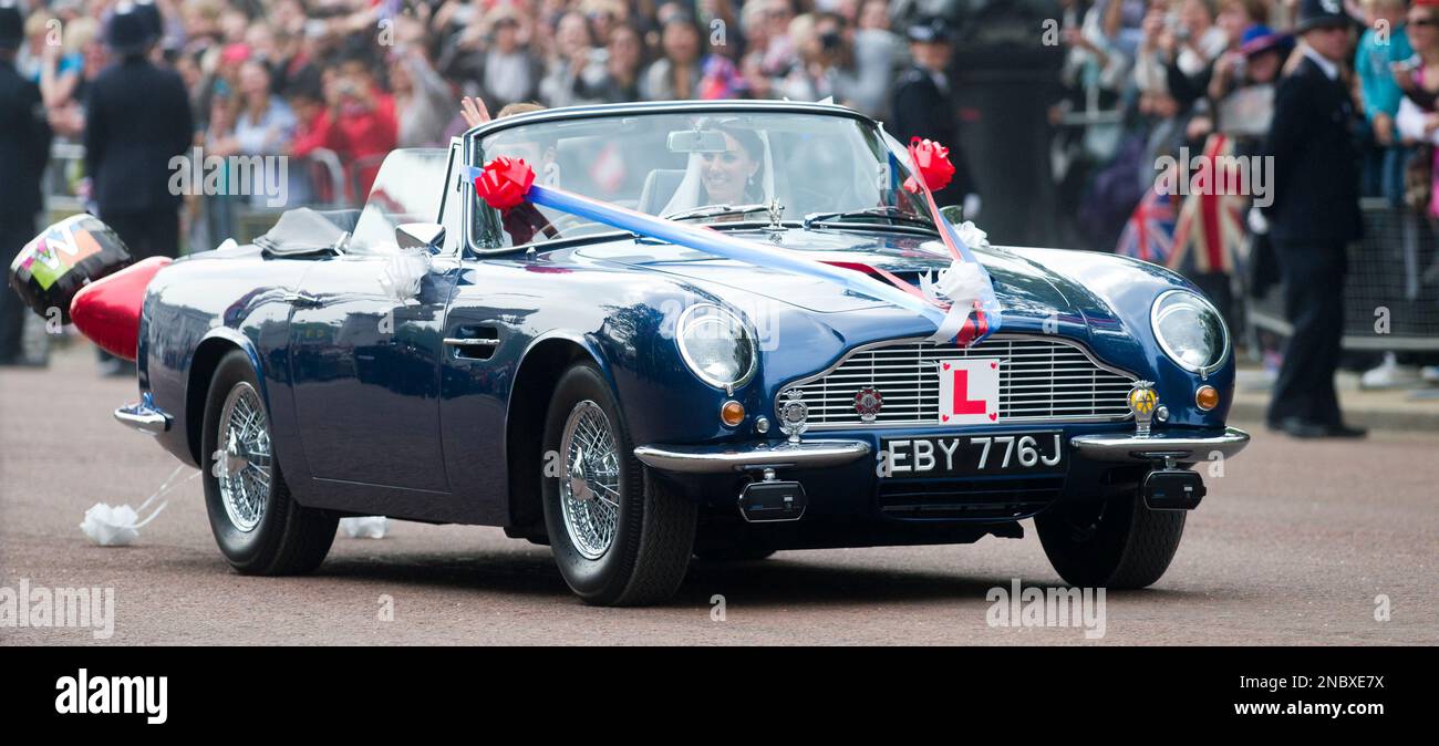 Britain's Prince William drives his wife Kate, Duchess of Cambridge ...