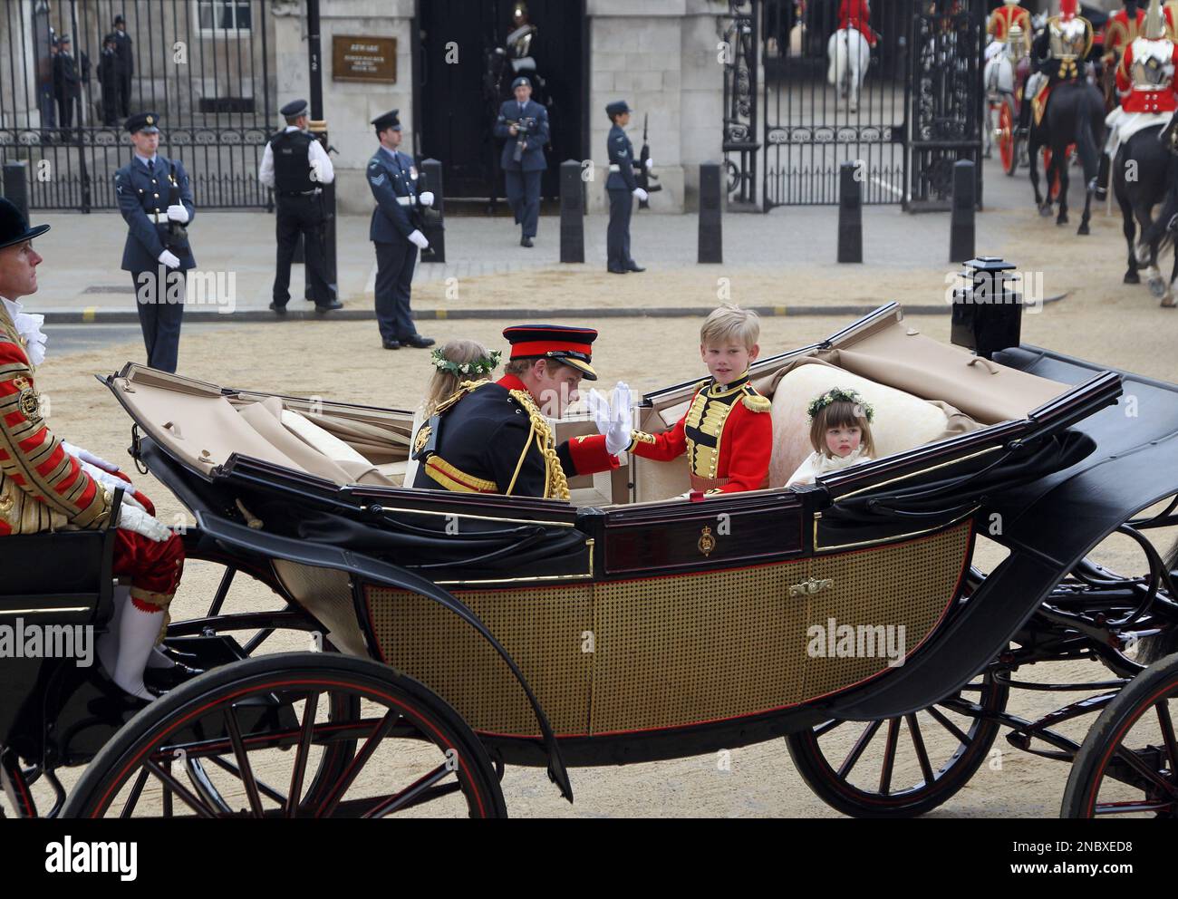 Prince Harry, page boy Tom Pettifer and bridesmaid Eliza Lopes make the ...