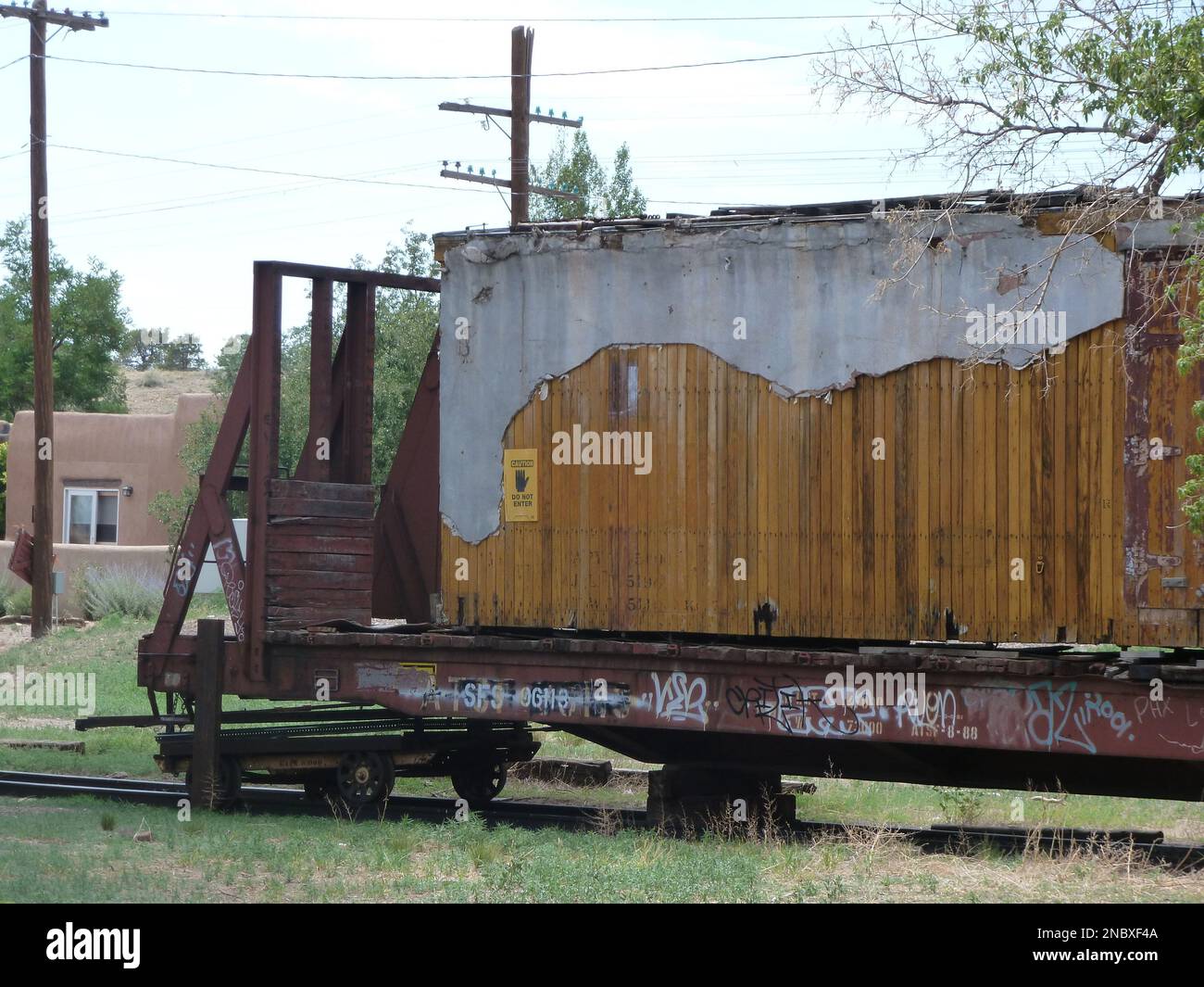 An old industrial train car with a damaged container Stock Photo - Alamy