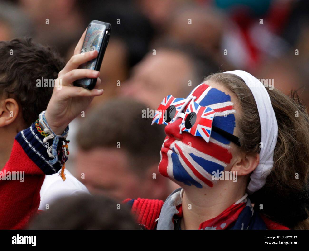 A spectator takes a photo outside of Westminster Abbey before the Royal ...