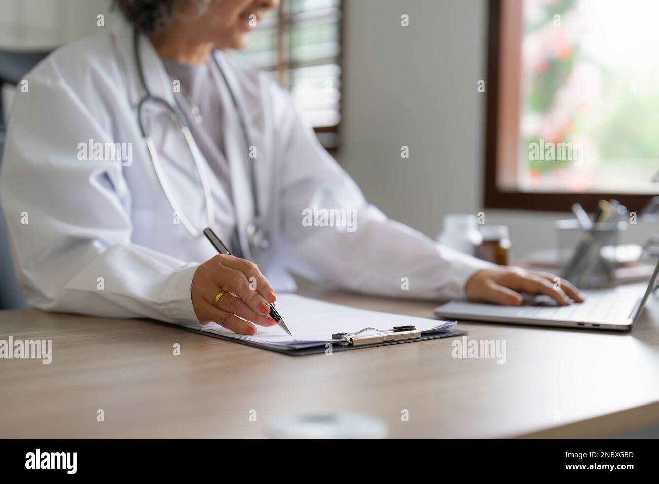 Professional doctor working at clinic. Digital healthcare and network ...