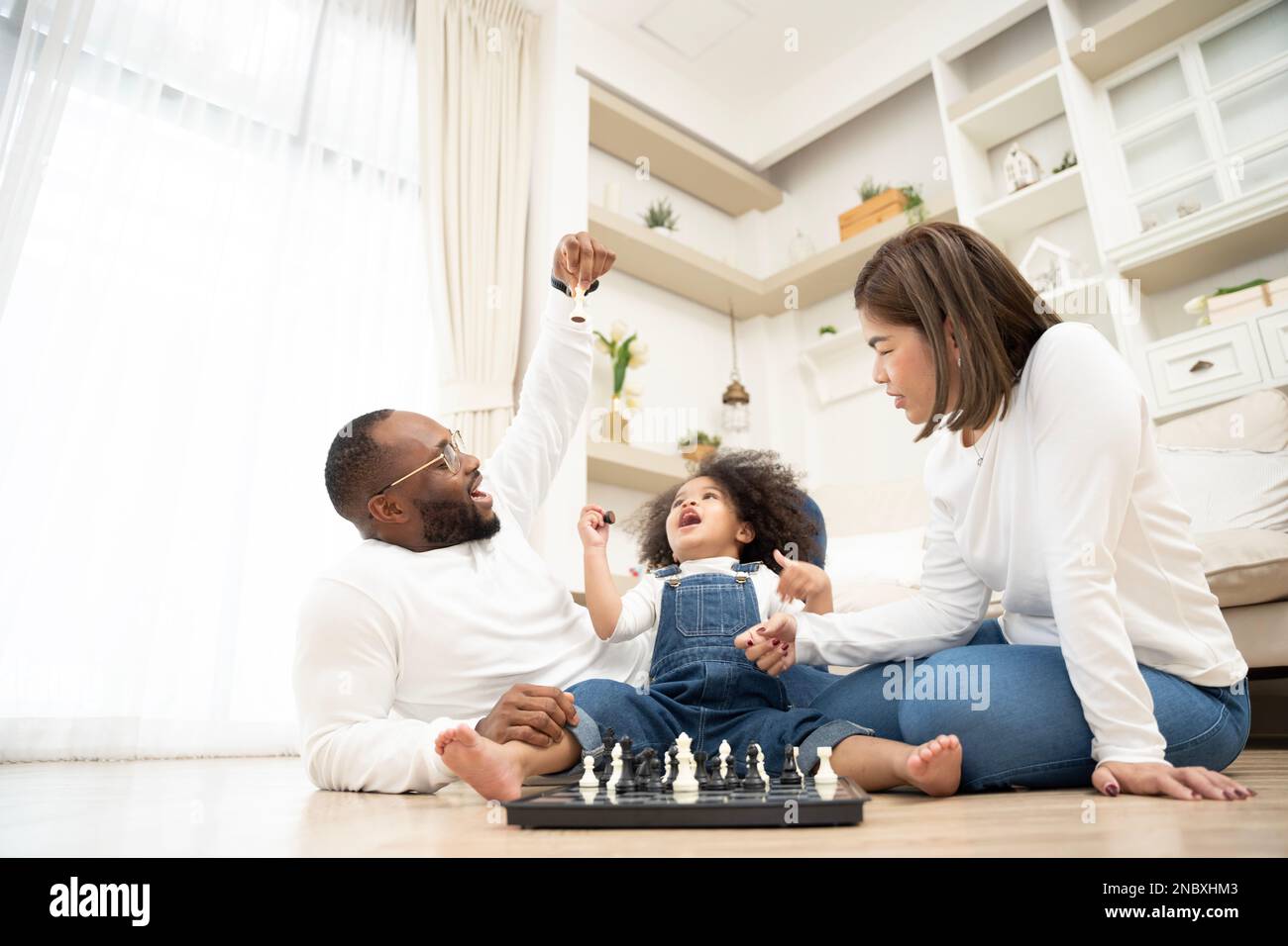 African family, father, mother, daughter doing various activities ...