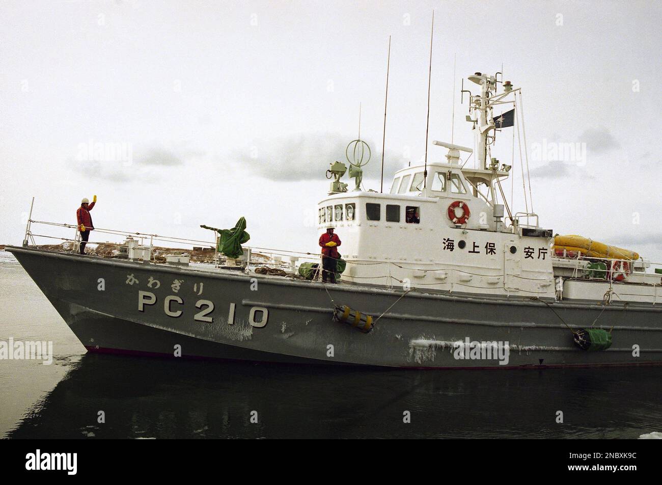 Crewmen work on the deck of Kawagiri, a Maritime Safety Agency’s patrol ...