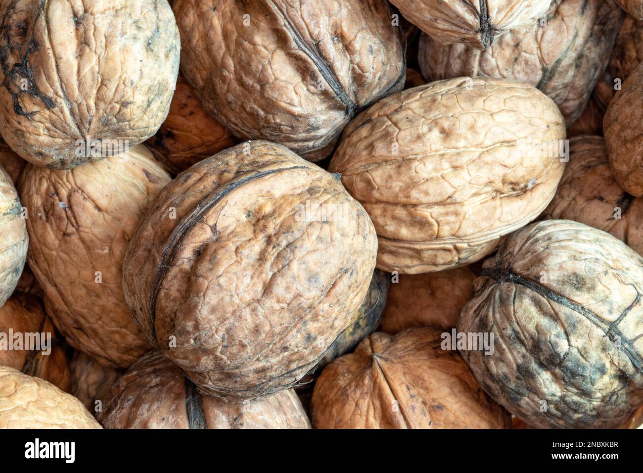 Bulk walnuts in close-up view Stock Photo - Alamy