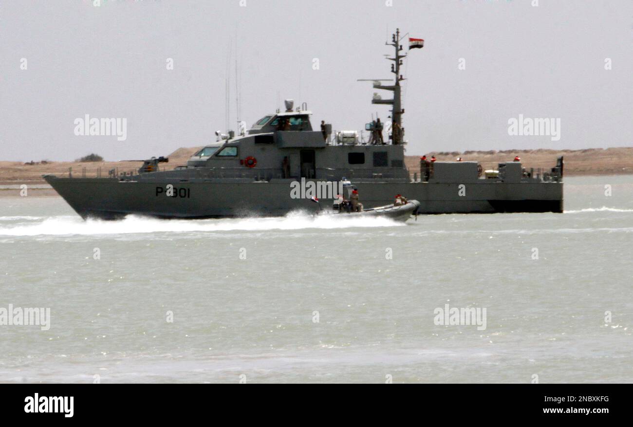 Iraqi navy sailors maneuver their boats during a training exercise in ...