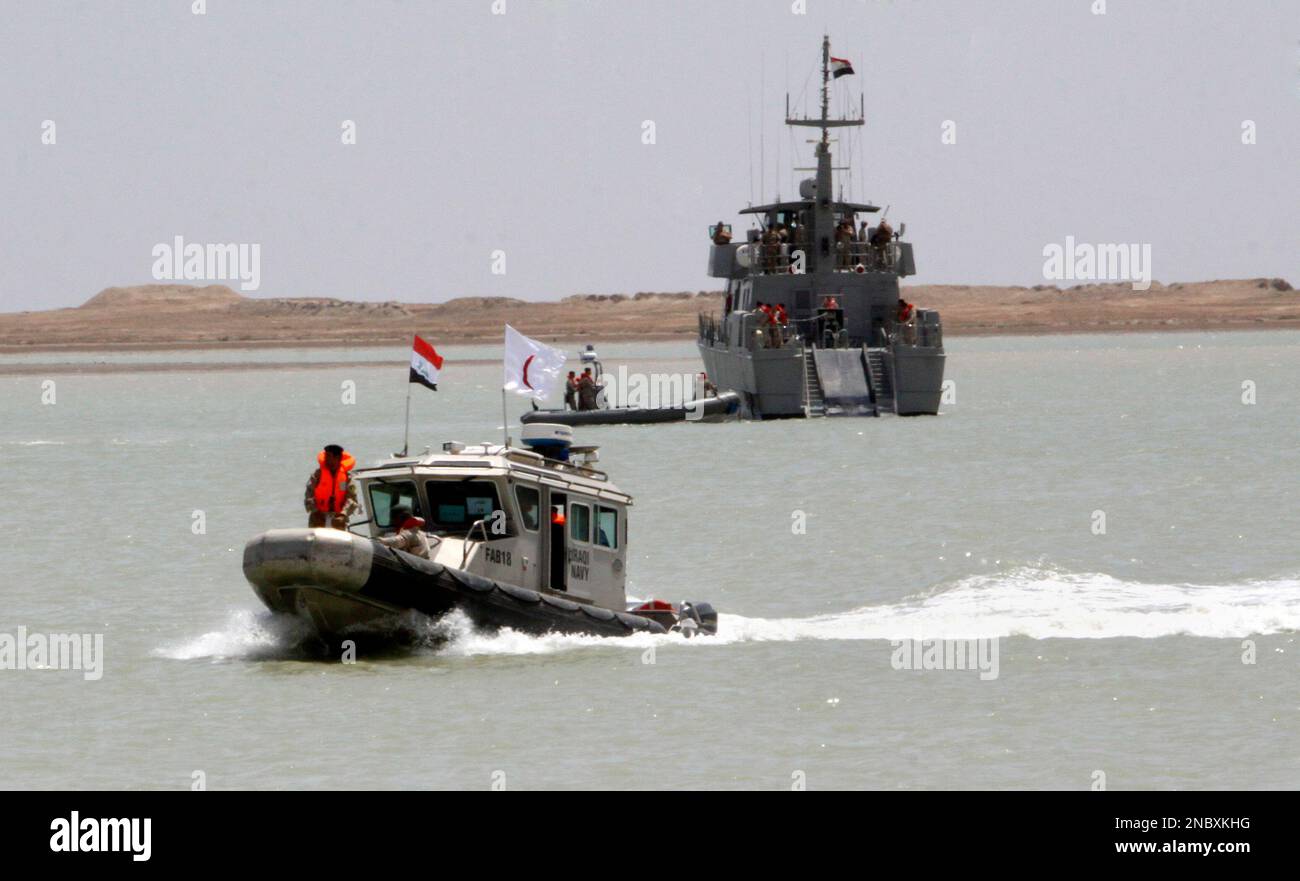 Iraqi navy sailors maneuver their boats during a training exercise in ...