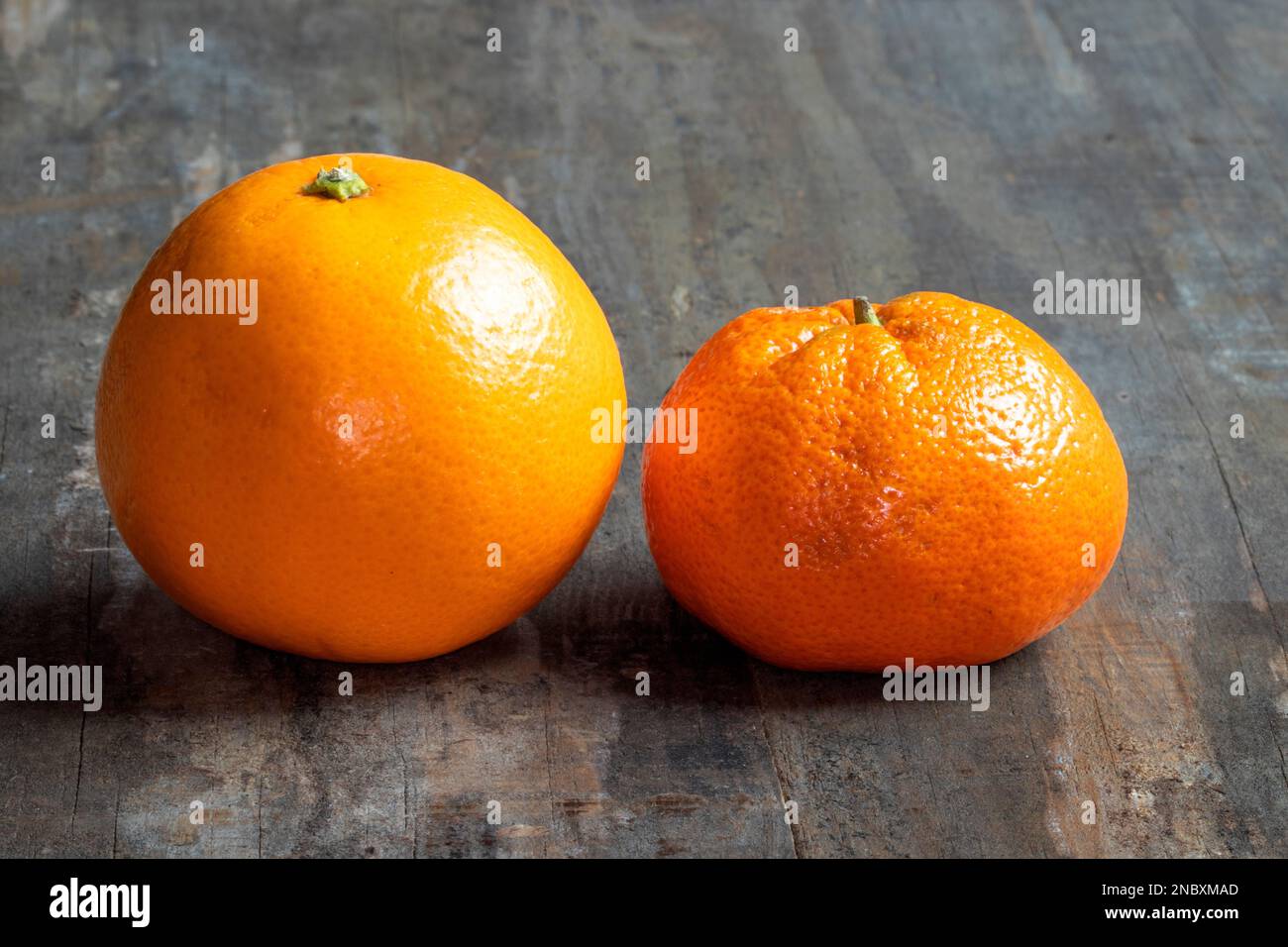 Orange and tangerine on a background of old wooden boards Stock Photo ...