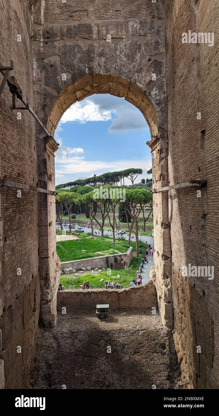 A beautiful view through an archway of the Colosseum in Rome, Italy ...