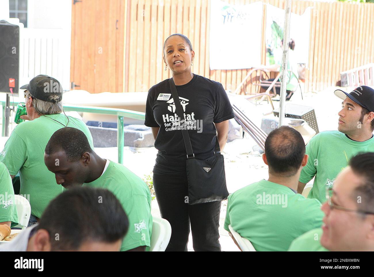 Volunteers work to build the playground donated by Sprite Spark Parks ...
