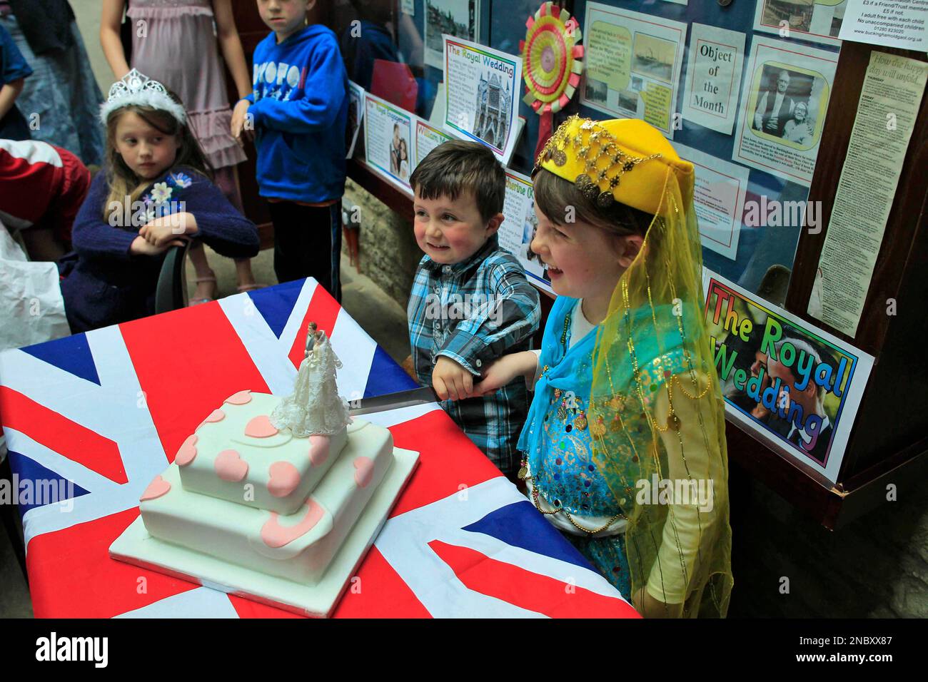 Local children Gabriel Perry, second right, aged four, and Caitlin ...