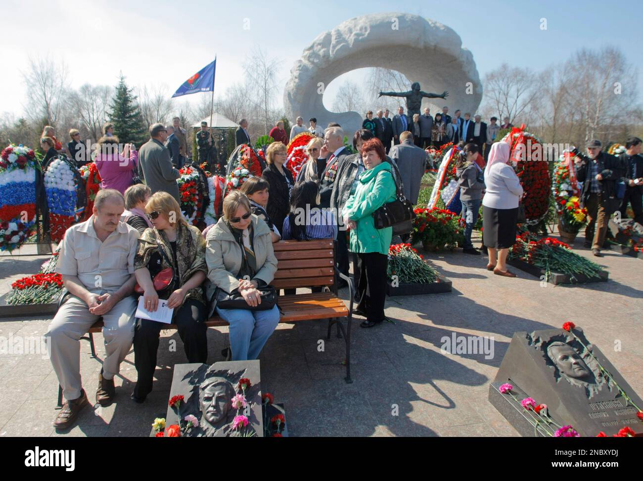 People mourn during a memory ceremony marking the Chernobyl nuclear ...