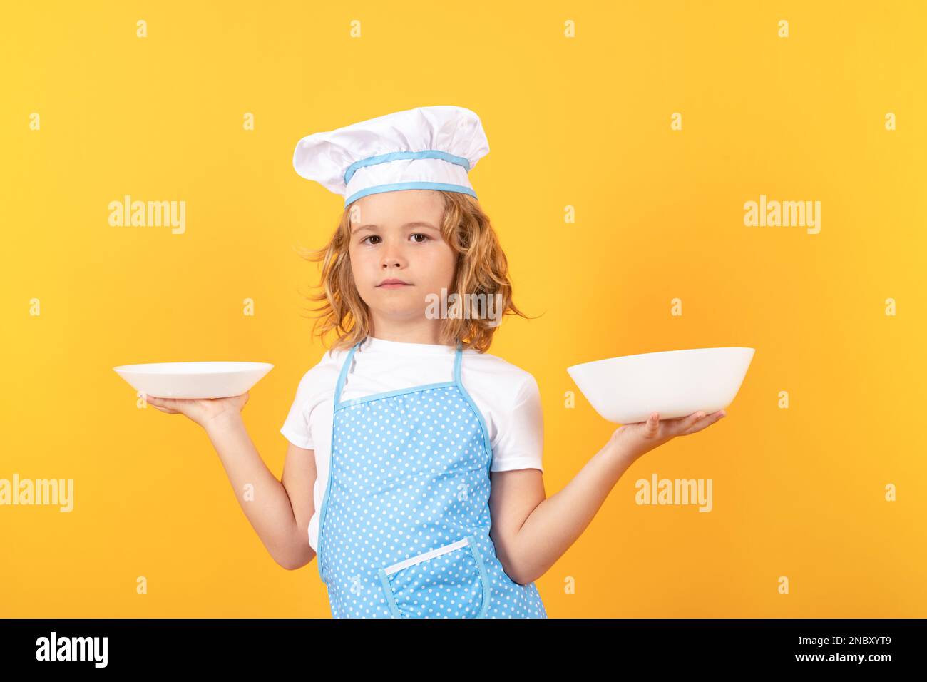 Funny kid chef cook with kitchen plate, studio portrait. Kid chef cook ...