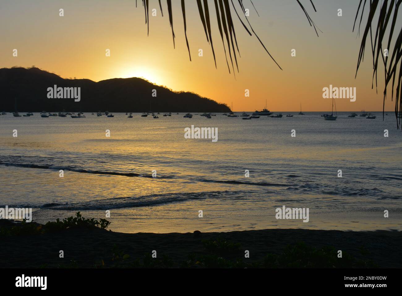 Wave patterns on water covered beach on Playa Coco, Costa Rica, at ...