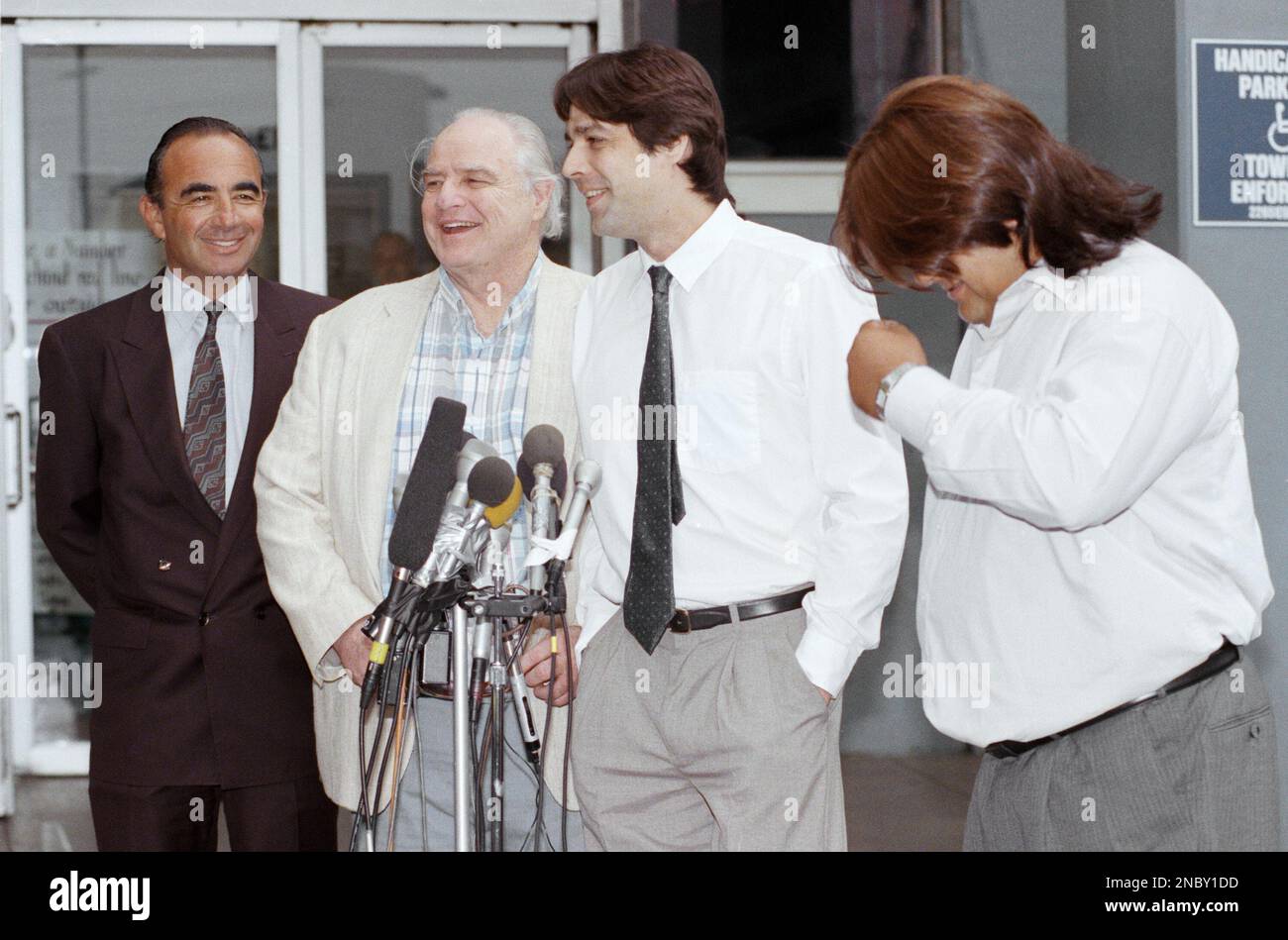 Christian Brando and his father, actor Marlon Brando, smile as they ...