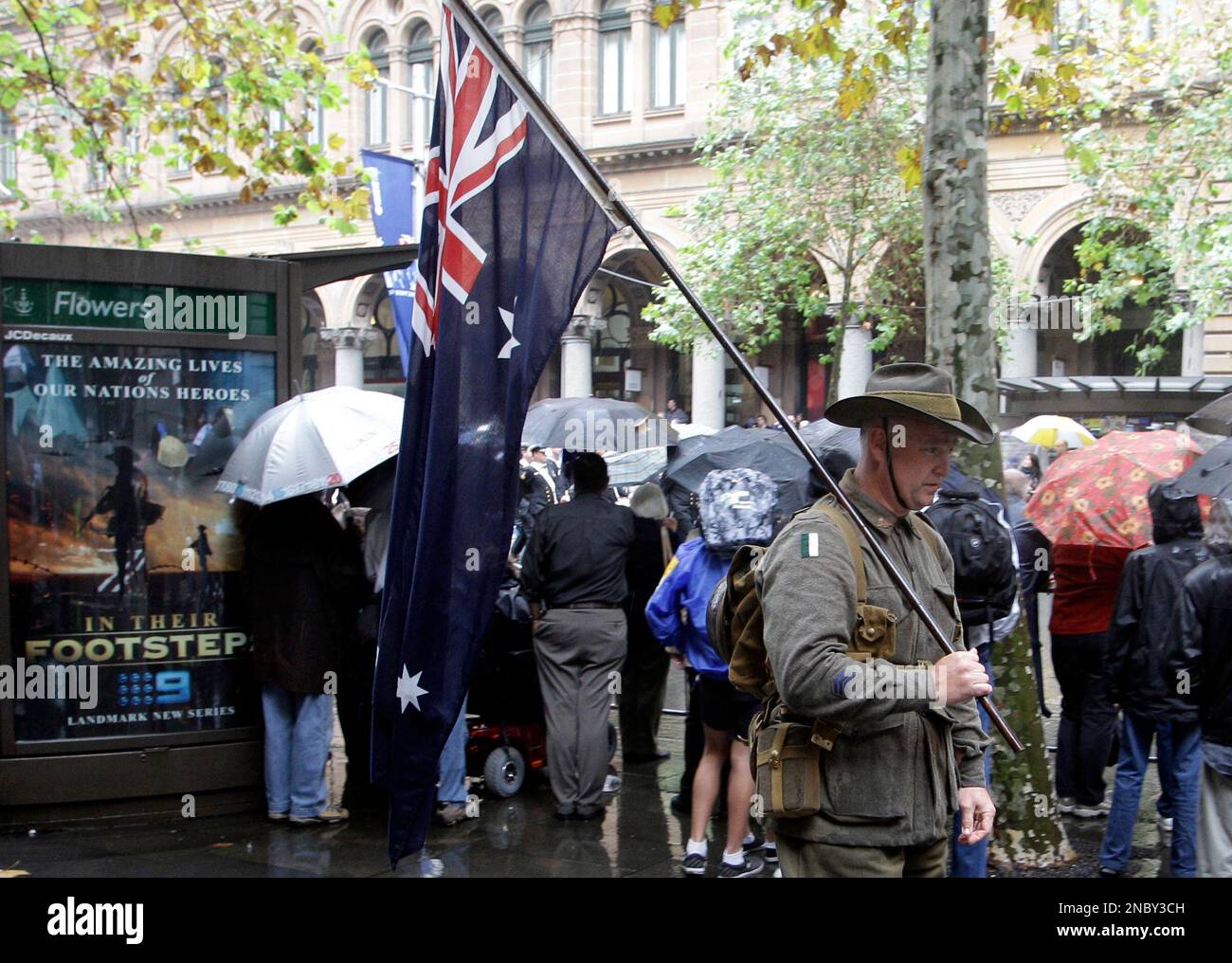 A person dressed in a WWl Australian soldier's uniform walks in the ...