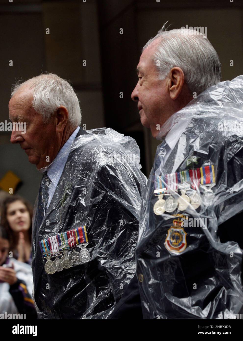 Veterans walk in the rain during an annual Anzac Day parade in Sydney ...