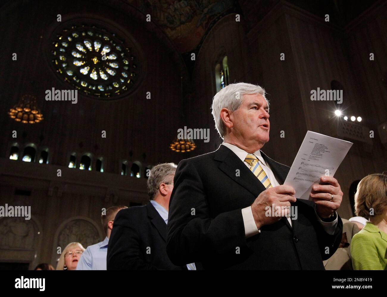 Former Speaker Newt Gingrich sings during Easter Mass at the Basilica ...