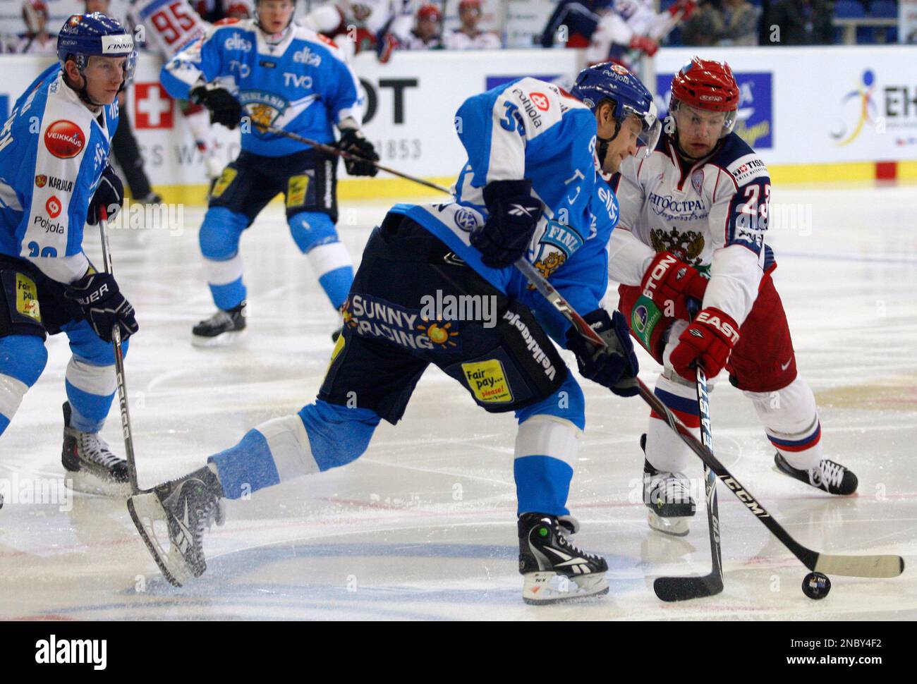 Finland's Niko Kapanen, left, fights for the puck with Alexey ...