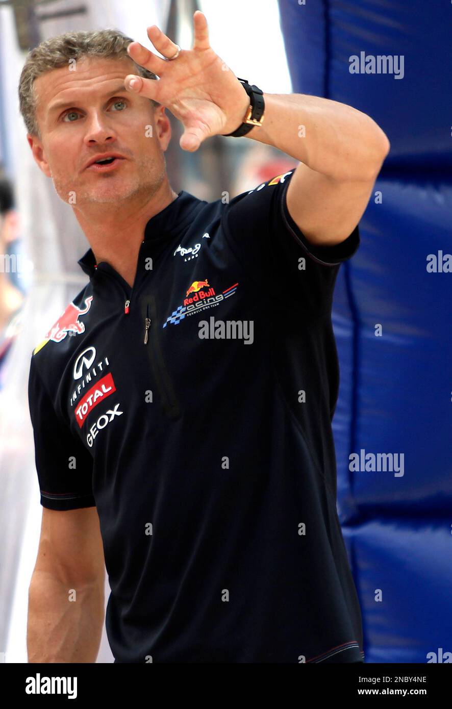 Former F1 driver David Coulthard speaks before he performs stunts in a ...