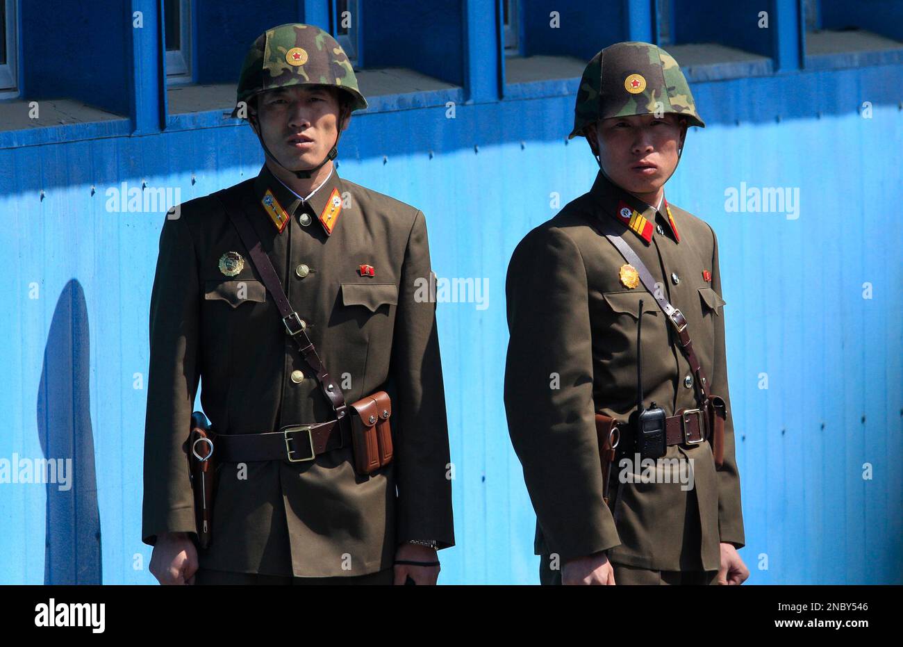 North Korean soldiers stand guard at the border village of the ...