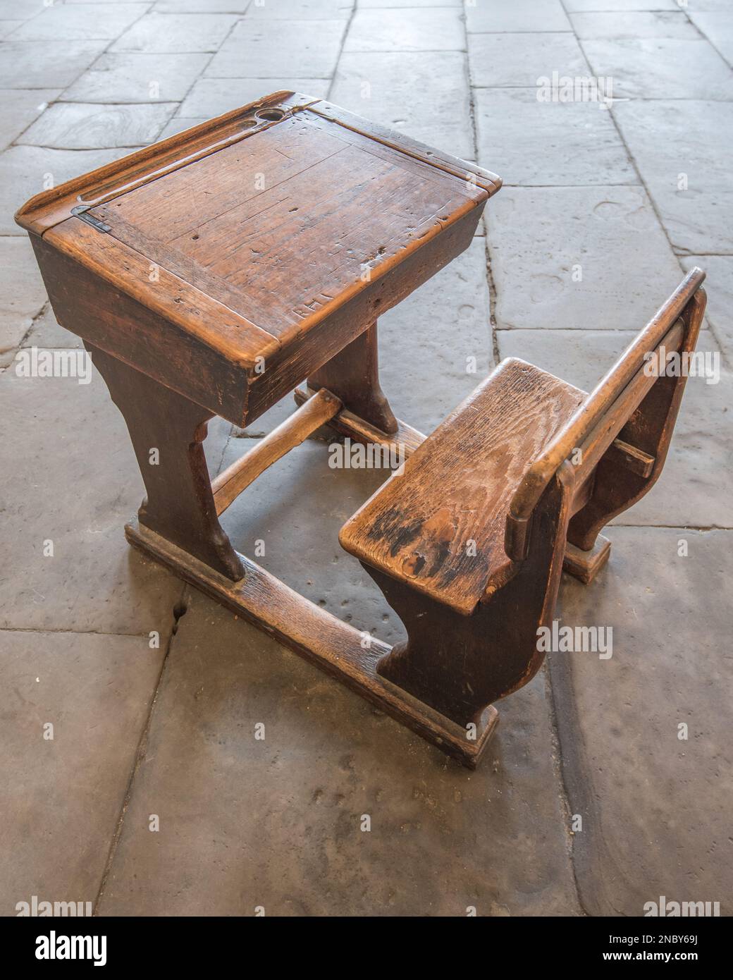 Vintage old school desk with lift up lid and footrest hi-res stock ...