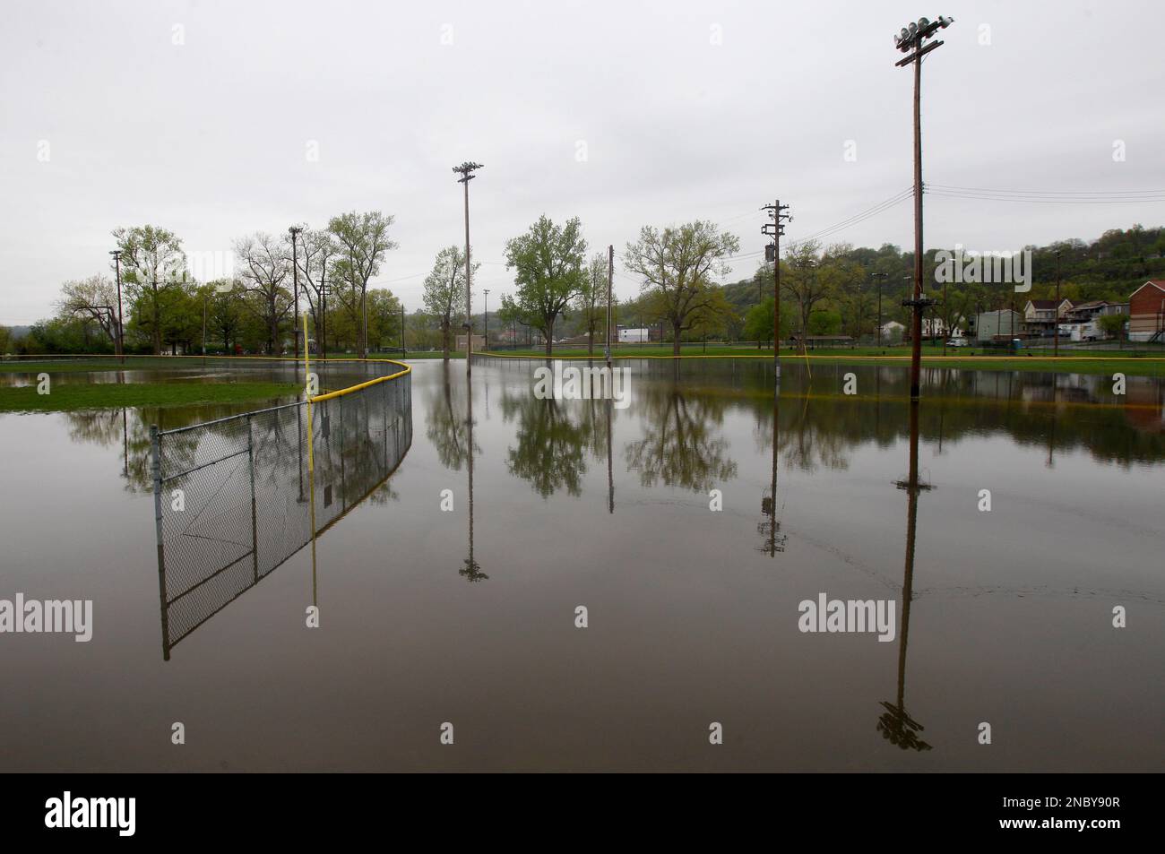 Water from the rising Ohio River covers a baseball field, Friday, April ...