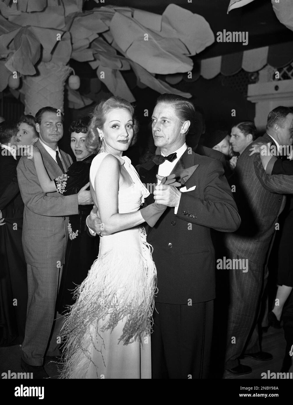 Film star Marlene Dietrich dances for the first time since she broke her ankle in a Hollywood ...